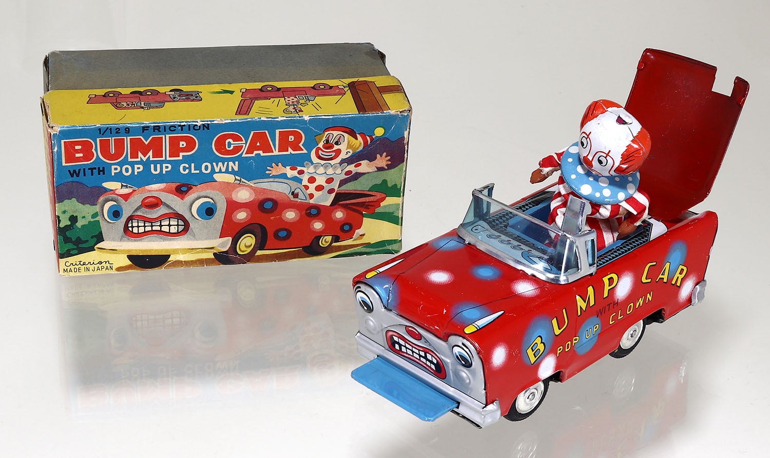 BUMP CAR WITH POP UP CLOWN