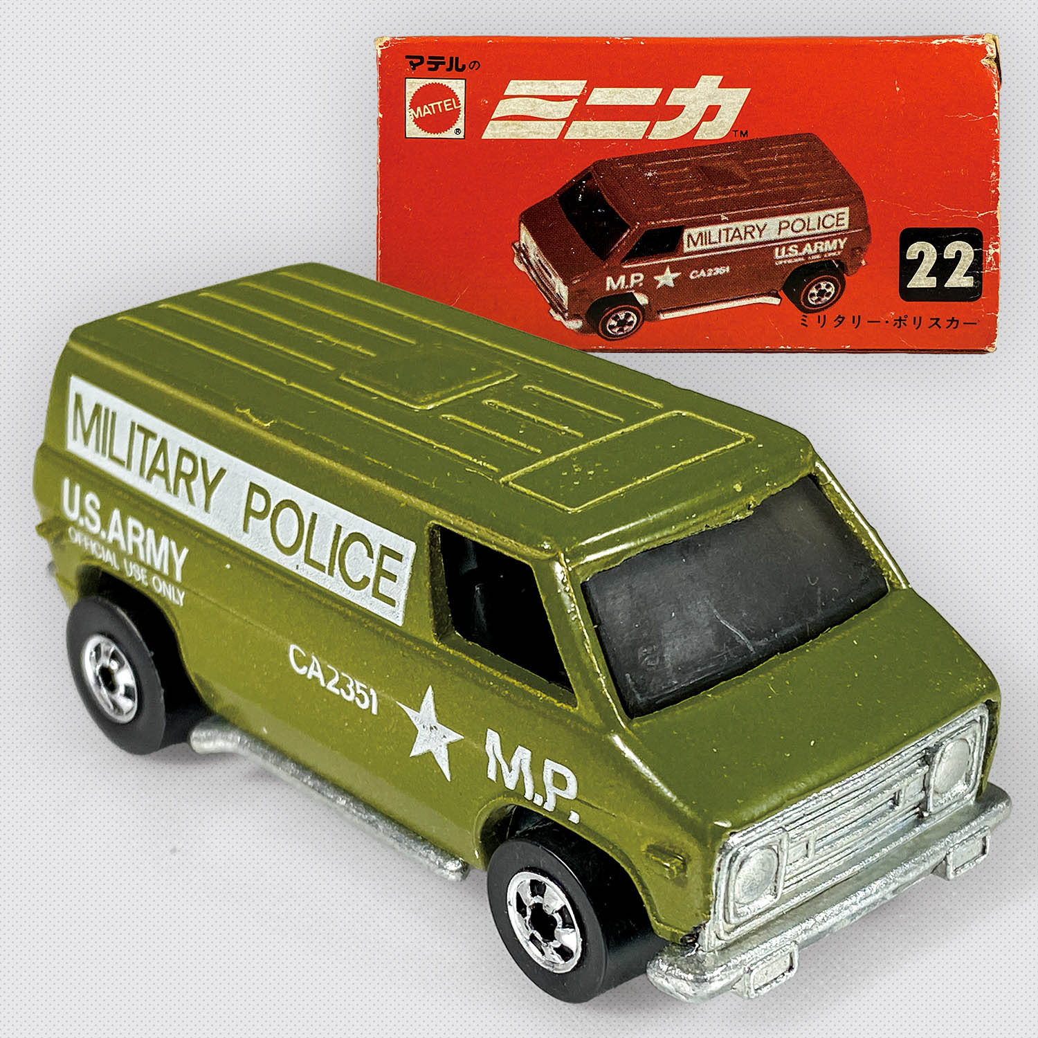 Minica and 22 and military police car and black wall/metal chassis