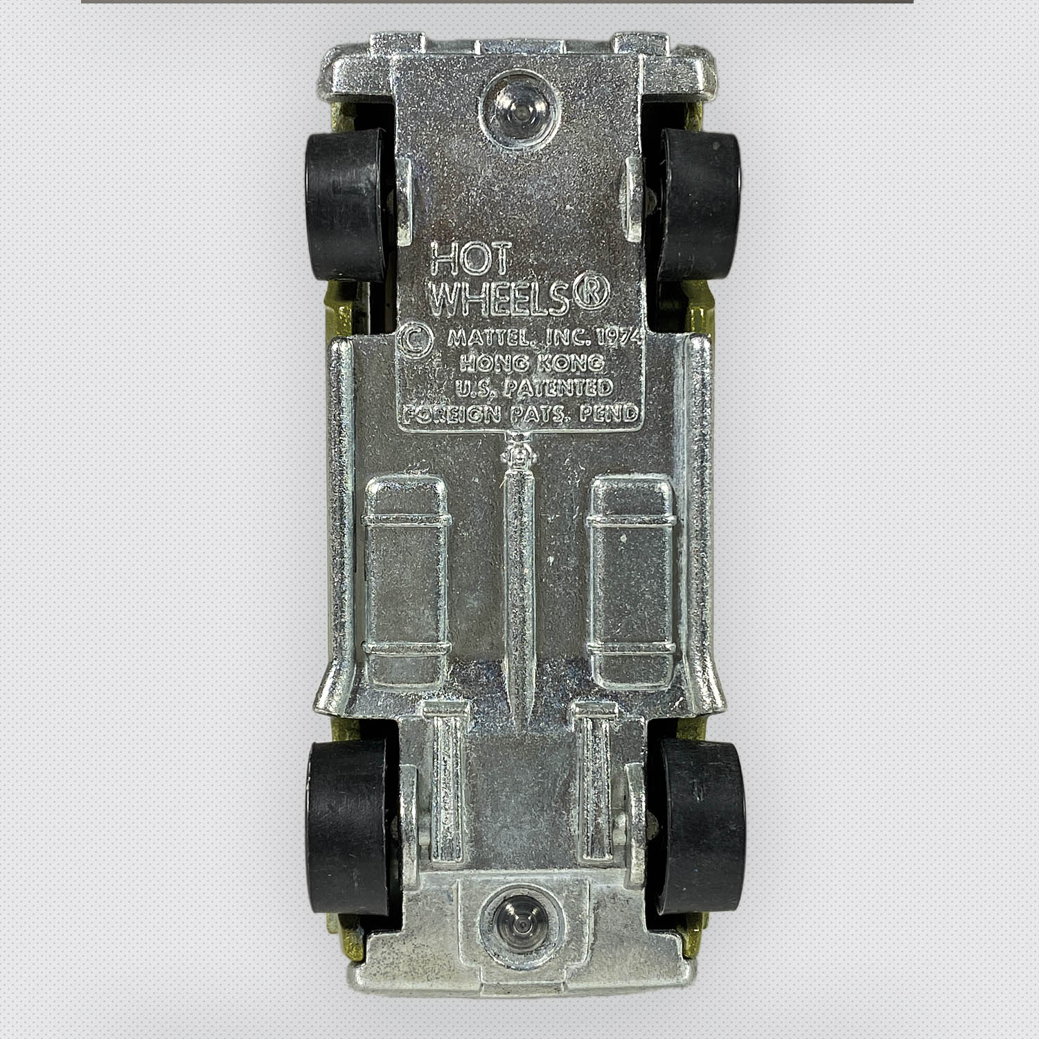 Minica and 22 and military police car and black wall/metal chassis